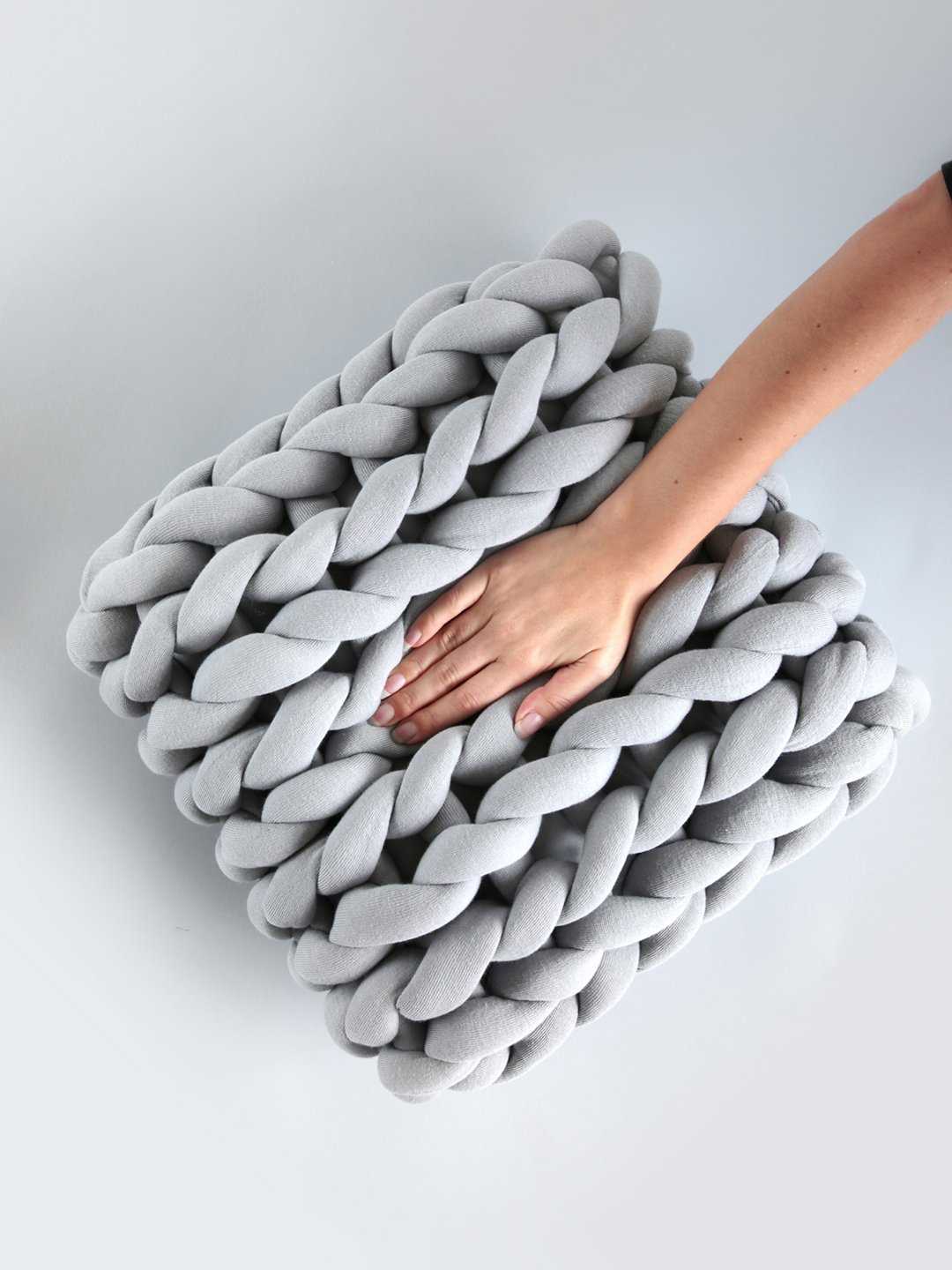 Cozy up your space with this chunky knit cushion pattern
