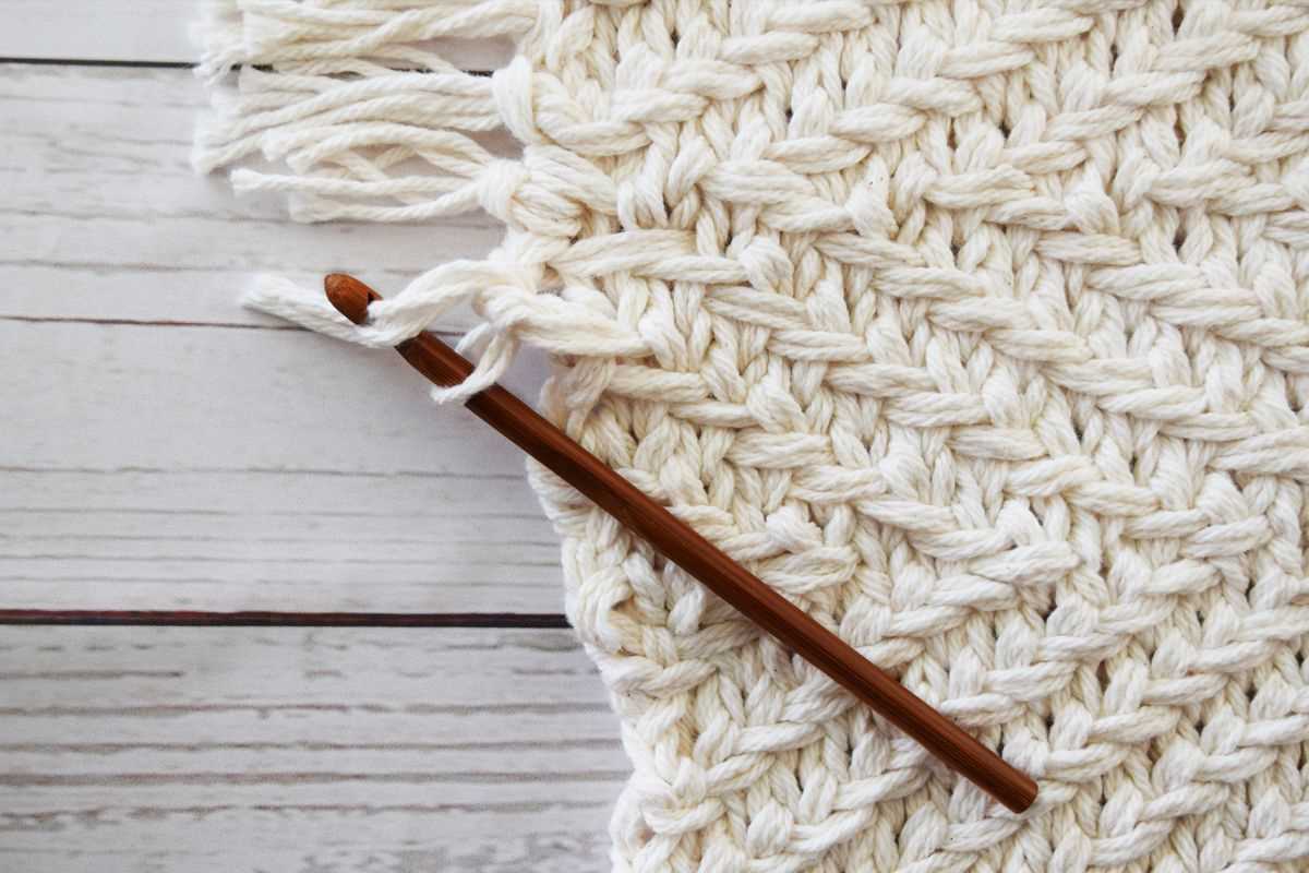 Cozy up with a free herringbone knit blanket pattern